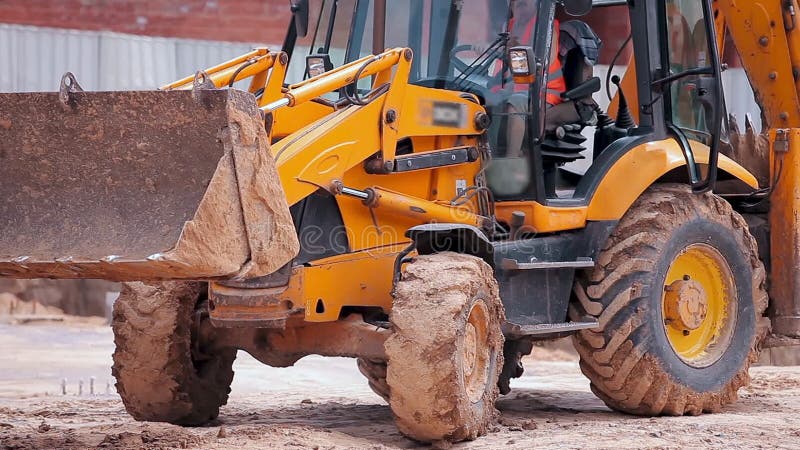 Yellow Tractor on a Construction Site. Professional Construction ...