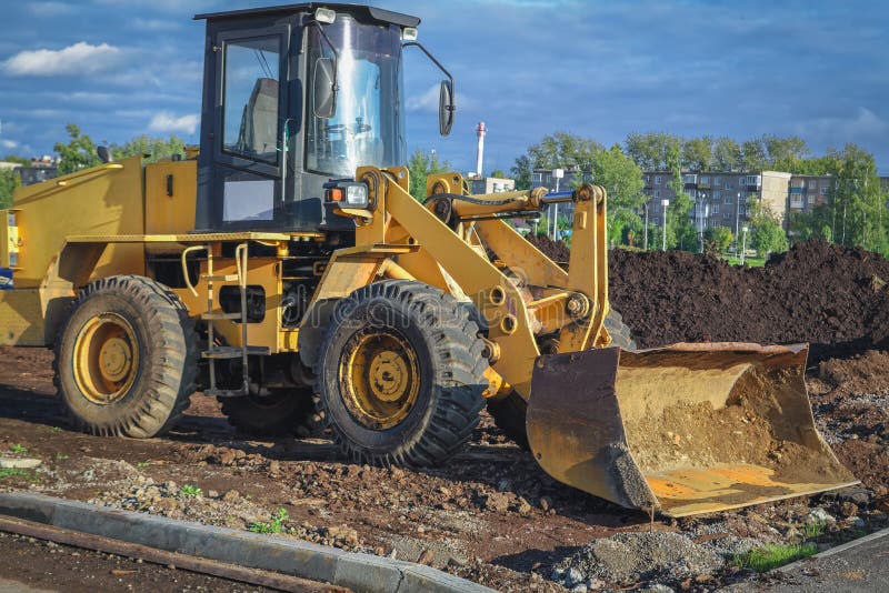 The Yellow Tractor at a Construction Site Stock Image - Image of ...