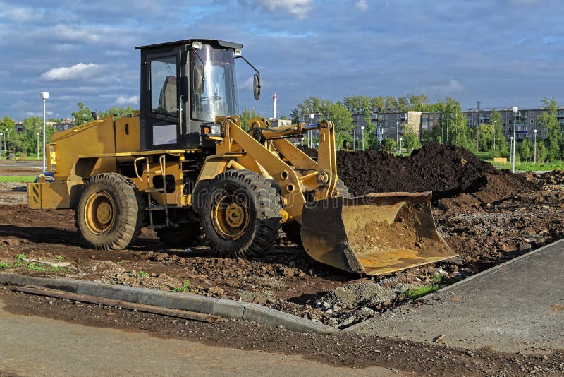 The Yellow Tractor at a Construction Site Stock Image - Image of ...