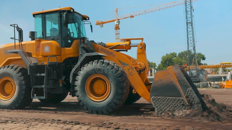 Yellow Tractor on a Construction Site. Professional Construction ...
