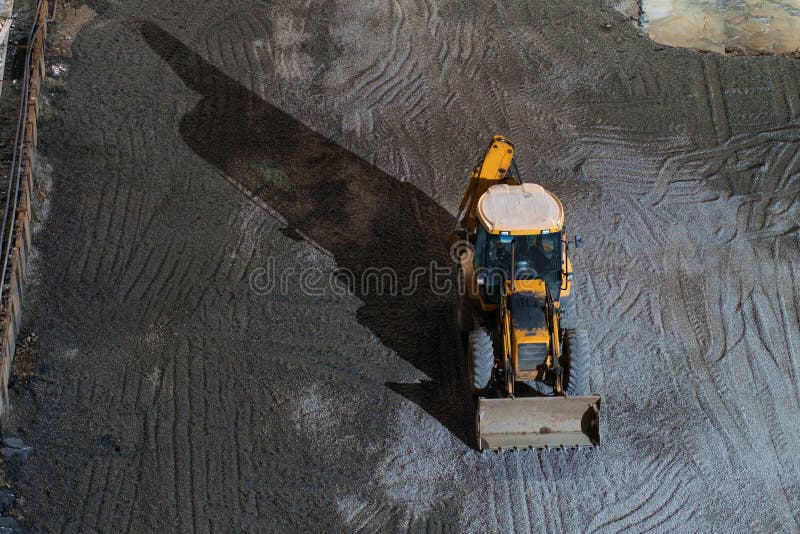 Yellow Tractor during a Night on the Gravel Ground Stock Image - Image ...
