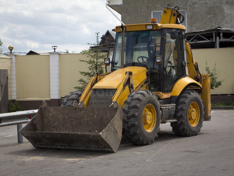 Yellow tractor stock photo. Image of heavy, yellow, eathmoving - 63414490