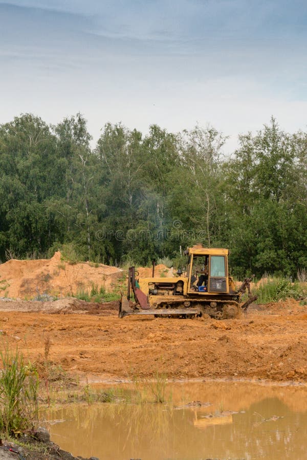 Yellow tractor stock image. Image of digging, machinery - 56566347