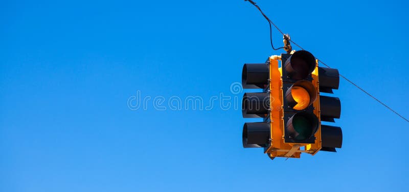 A Yellow Traffic Light with a Sky Blue Background Stock Image - Image ...
