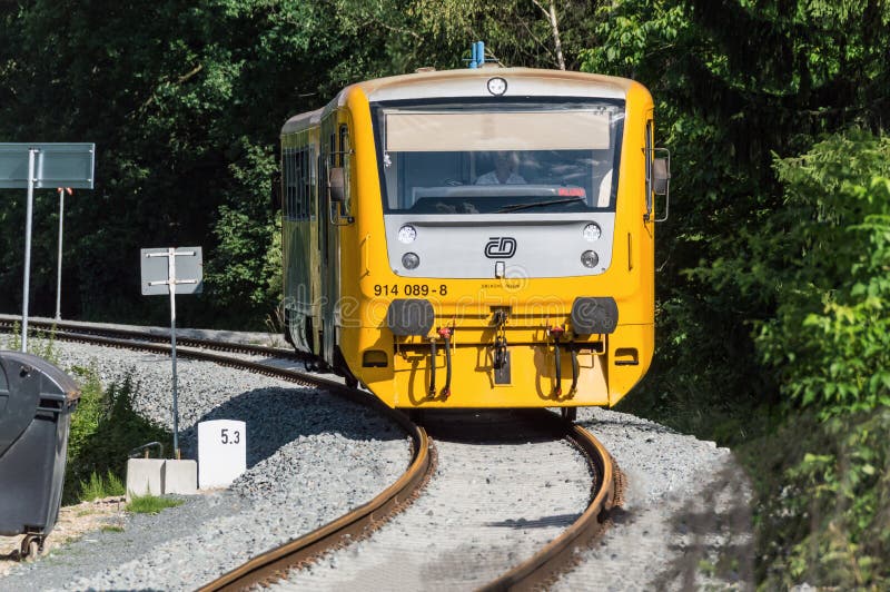 A Yellow Train Proceeding on the Tracks Editorial Stock Photo - Image ...