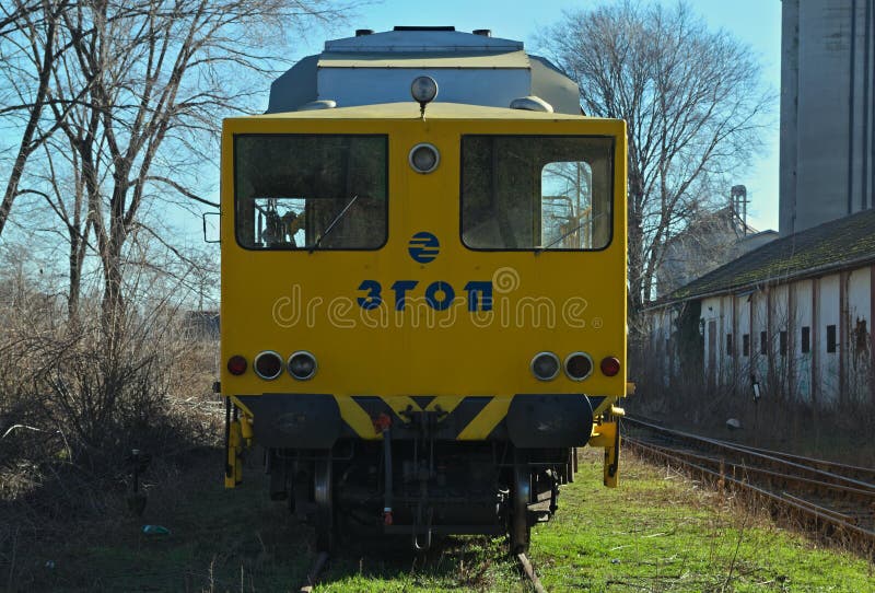 Yellow Train Sitting on Tracks in Rail Station Editorial Photography ...
