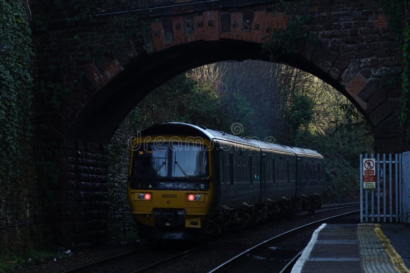 Yellow Train Speeds through City Tunnel on Railway Tracks Stock Image ...