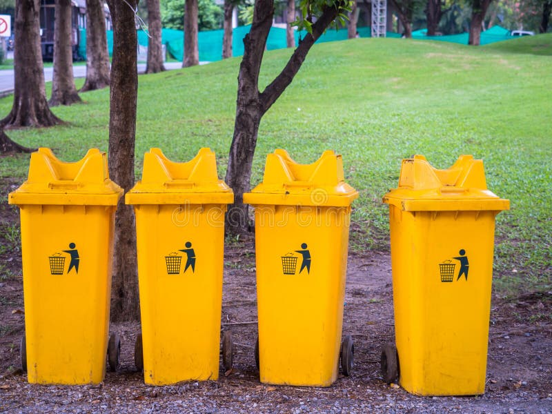 Yellow Trash Bins in the Park Stock Image - Image of tree, disposal ...