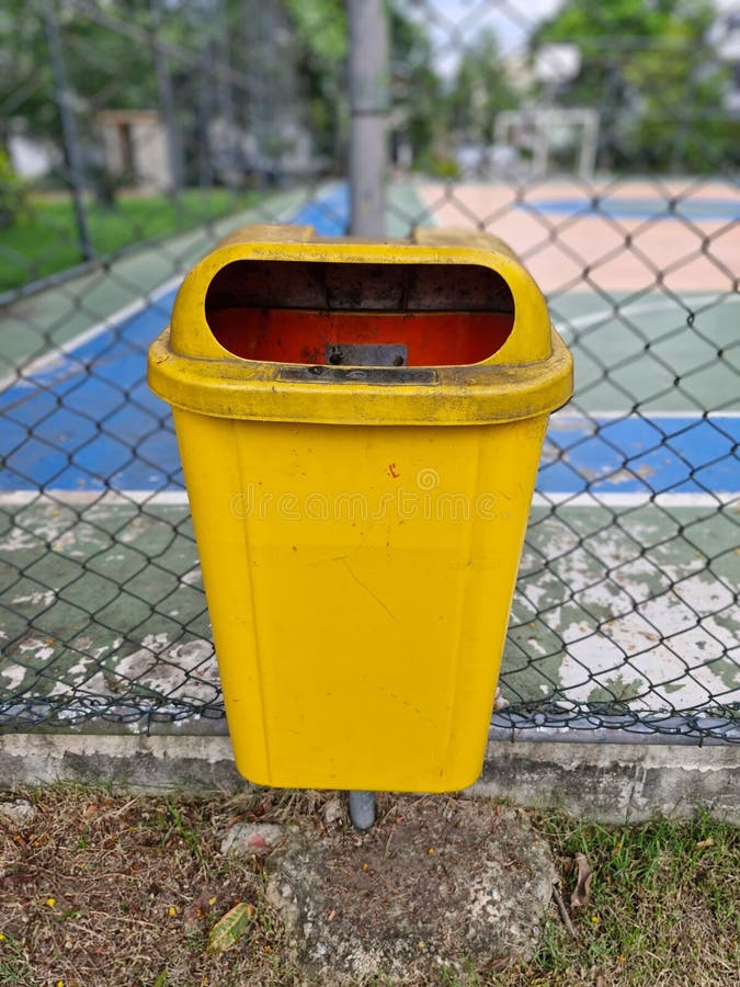 Yellow Trash Can in Condominium Square Stock Photo - Image of square ...