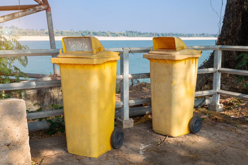 Yellow Trash Cans are Located Stock Image - Image of reuse, throw ...