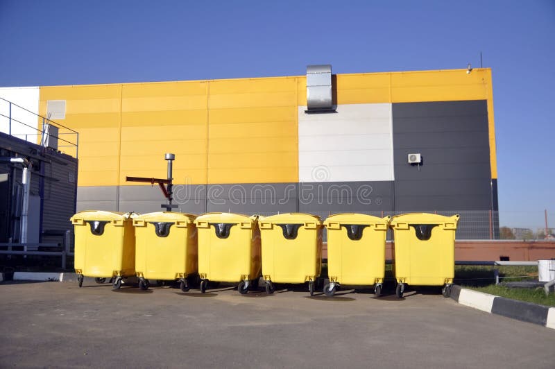 Yellow Trash Cans on Wheels for Waste Collection Stock Image - Image of ...