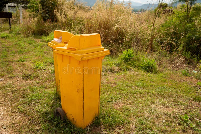 Yellow trash cans stock image. Image of park, concept - 223941739