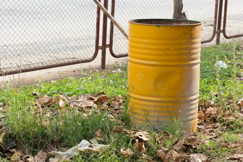 Yellow trashcan of recycle stock image. Image of trash - 57985761