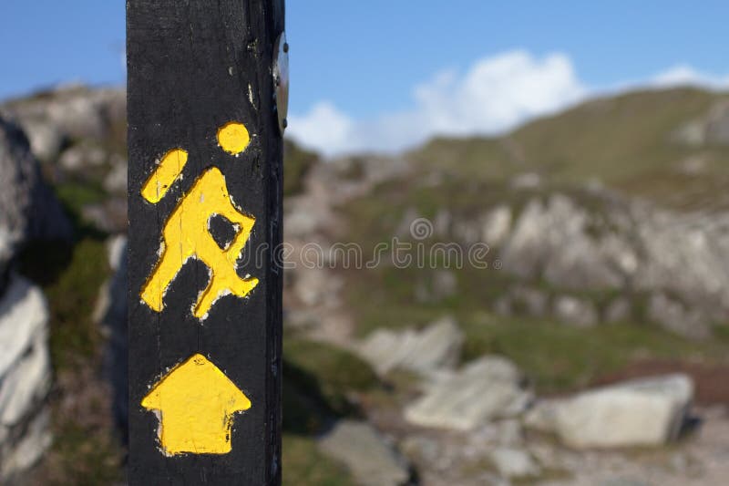 Yellow Trekking Sign on a Wooden Pole Stock Photo - Image of path, sign ...