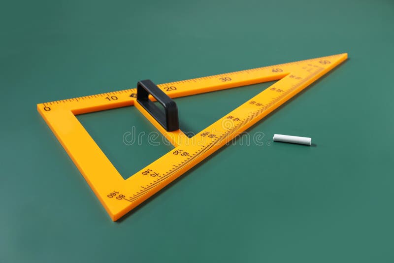 Yellow Triangle and Chalk on Green Chalkboard Stock Image - Image of ...