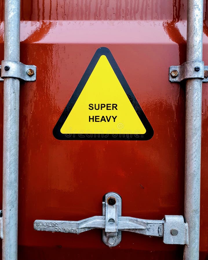 A Yellow Warning Triangle Informing of a Super Heavy Weight Stock Image ...