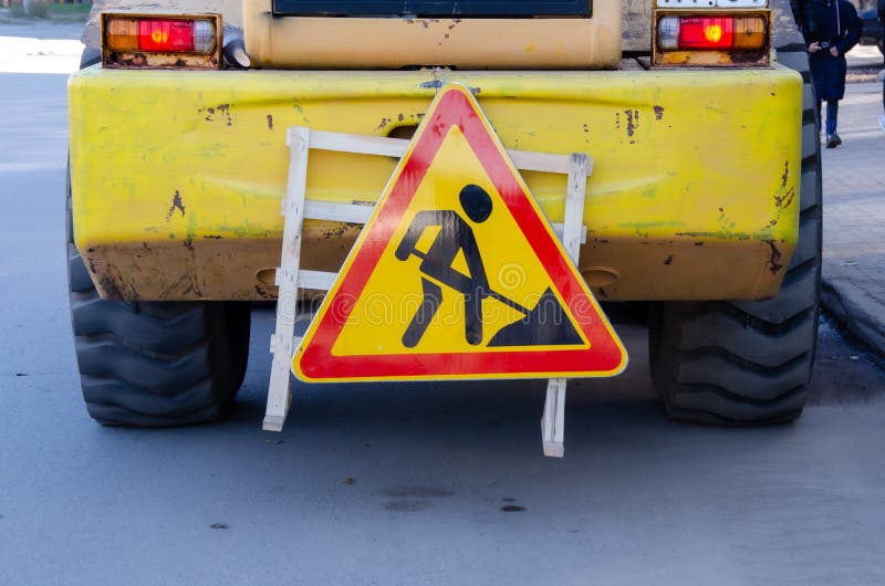 Yellow Triangular Warning Sign Work in Progress Next To Construction ...