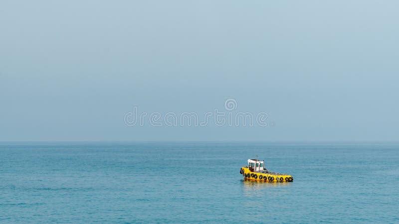 Yellow Tugboat in the Mediterranean Sea. Minimal Background Stock Photo ...