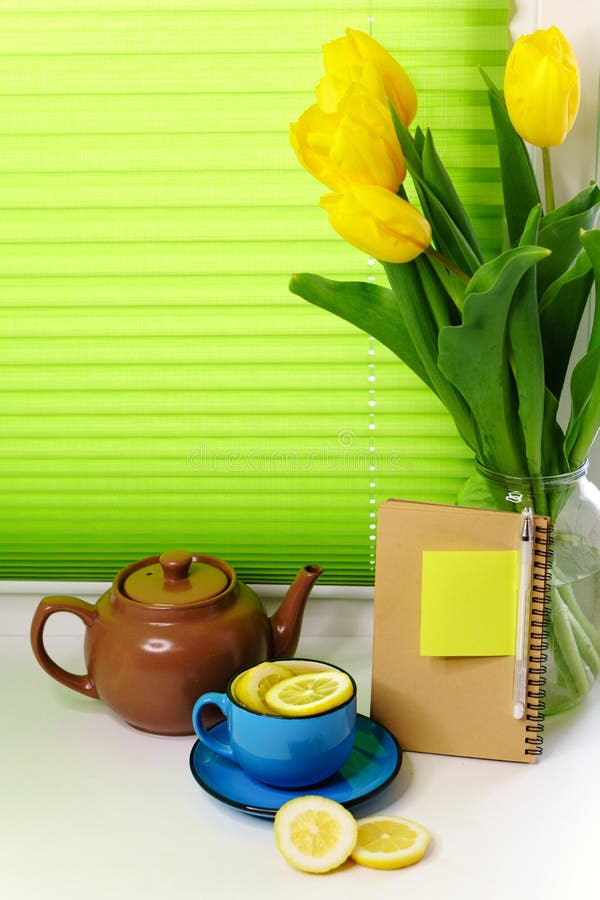 Yellow Tulips and Tea with Lemon Stock Photo - Image of flower, green ...