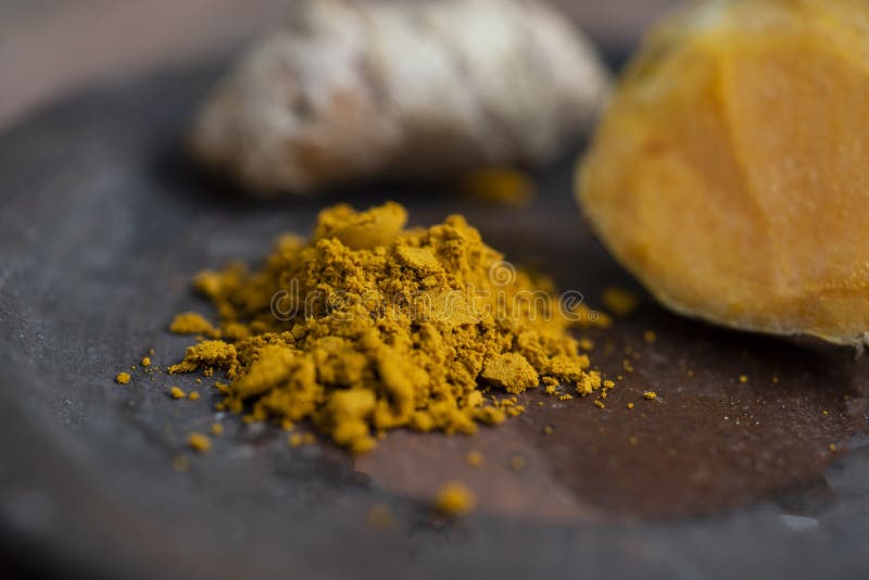 Yellow Turmeric Powder in Black Plate Stock Image - Image of herb ...
