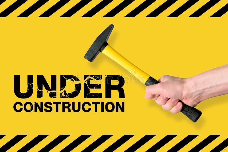 Yellow Under Construction Cracked Sign with Hammer in Human Hand Stock ...