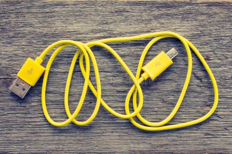Yellow USB Cable on Wooden Table Stock Image - Image of peripheral ...