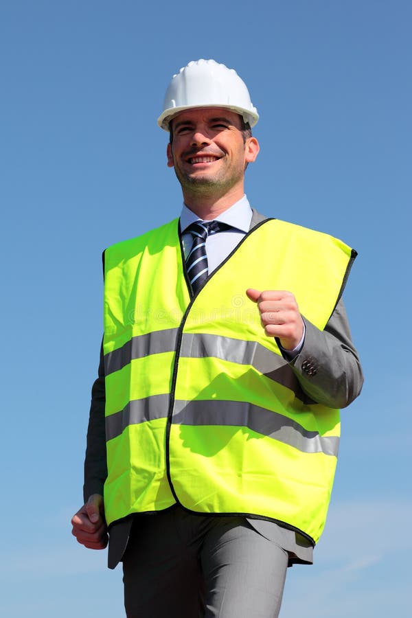 Yellow vest and hardhat stock image. Image of crossed - 21143193