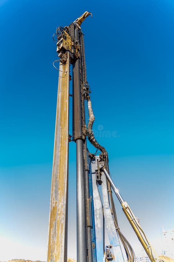 The Yellow Vibrating Piling Machine Removes Larssen Sheet Piling from ...