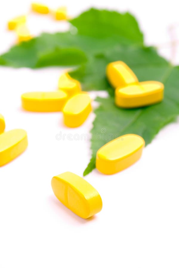 Yellow vitamin pills stock photo. Image of isolated, herbal - 14496556