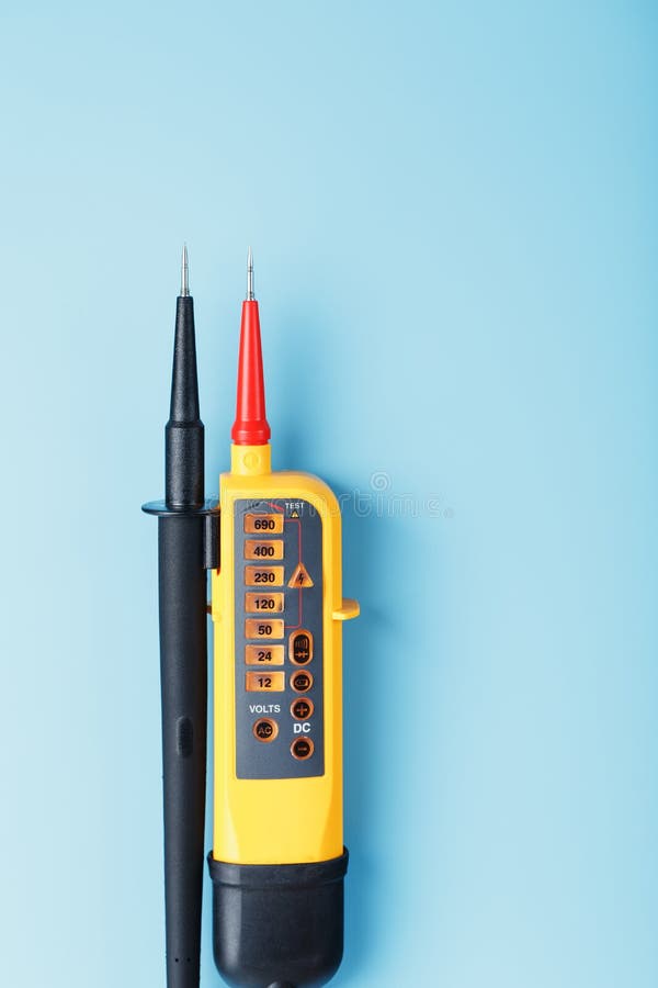 Two-pole Voltage Indicator Close-up on a Blue Background. Stock Image ...