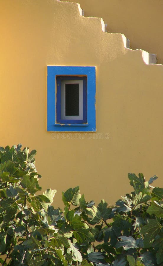 Yellow Wall with Blue Window Stock Image - Image of blue, architecture ...