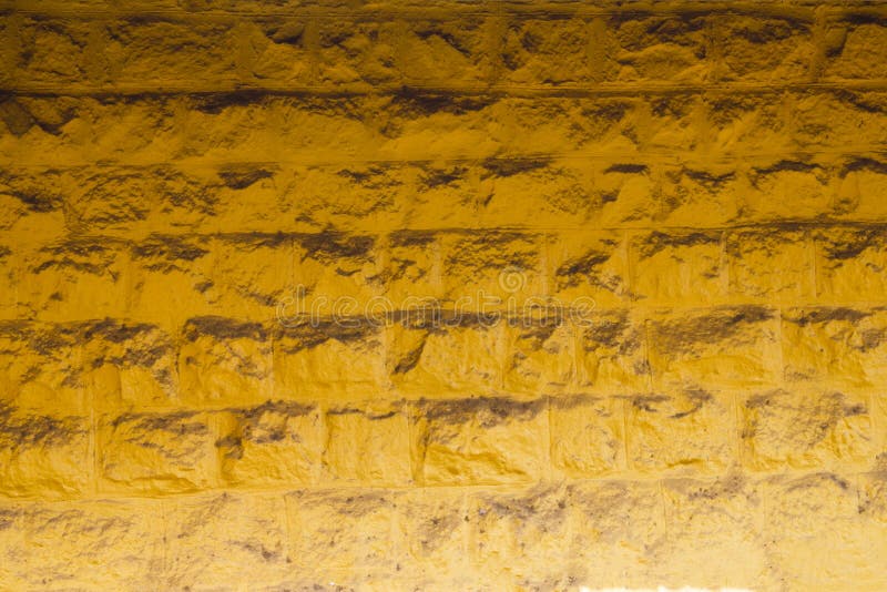 Yellow Wall of Large Bricks with Shadow. Rough Surface Texture Stock ...
