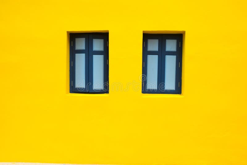Yellow Wall with Two Windows Stock Photo - Image of paint, street: 78321876