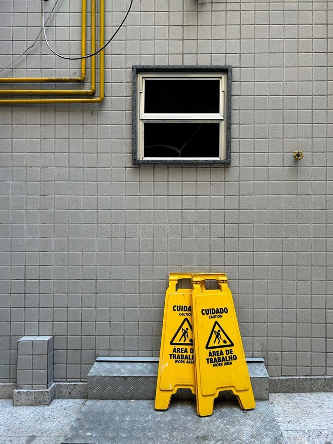 Yellow Warning Signs on Tiled Wall Stock Photo - Image of design ...