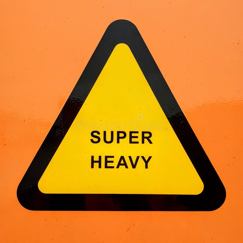 A Yellow Warning Triangle Informing of a Super Heavy Weight Stock Image ...