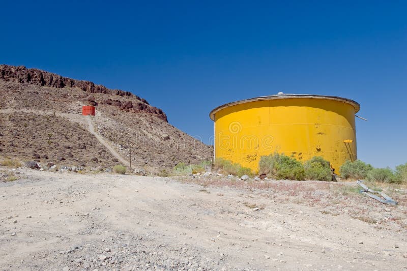 Yellow Water Tank in Desert Stock Photo - Image of single, container ...