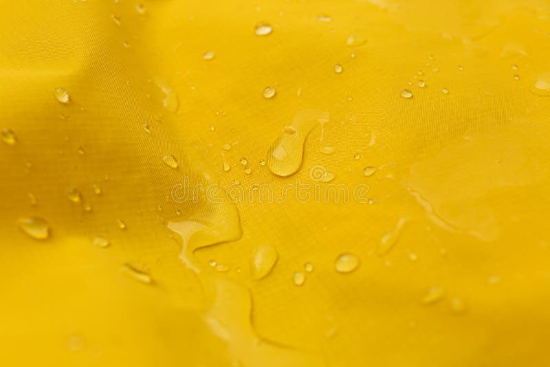 Yellow Waterproof Fabric with Water Drops As Background, Closeup Stock ...