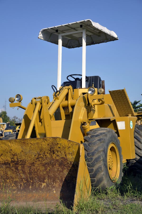 Yellow wheel Dozer stock image. Image of construction - 11588753