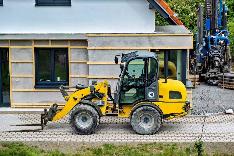 Yellow Wheeled Tractor Forklift. Construction Equipment for Lifting and ...