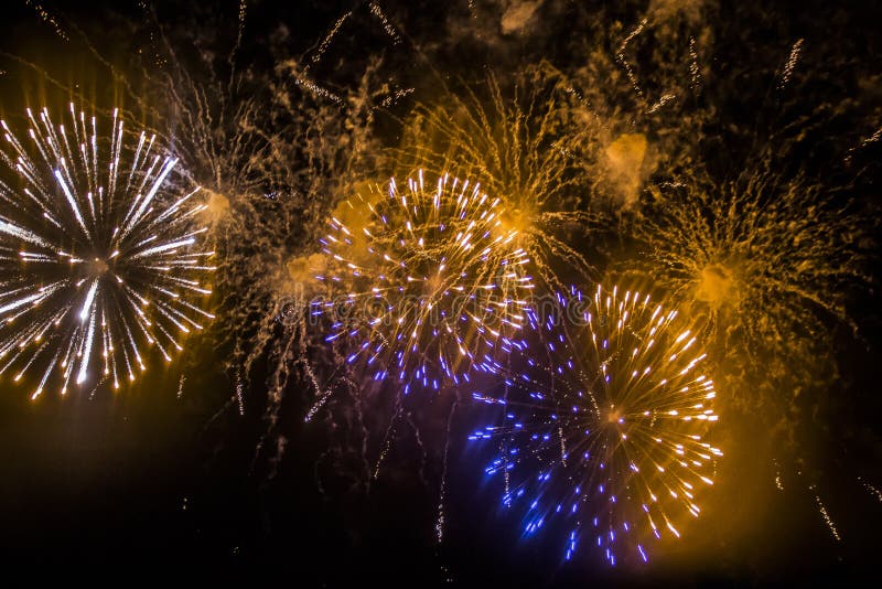 Yellow, White, Blue Fireworks in the Sky Stock Photo - Image of white ...