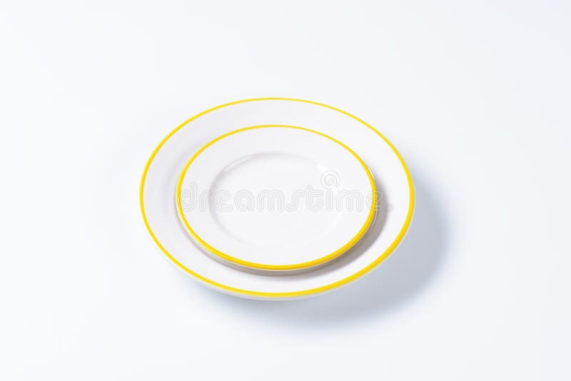 Yellow and White Dinner Plates Stock Photo - Image of plain, modern ...