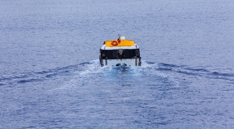 Yellow Lifeboat Under Blue Bulkhead Stock Image - Image of emergency ...