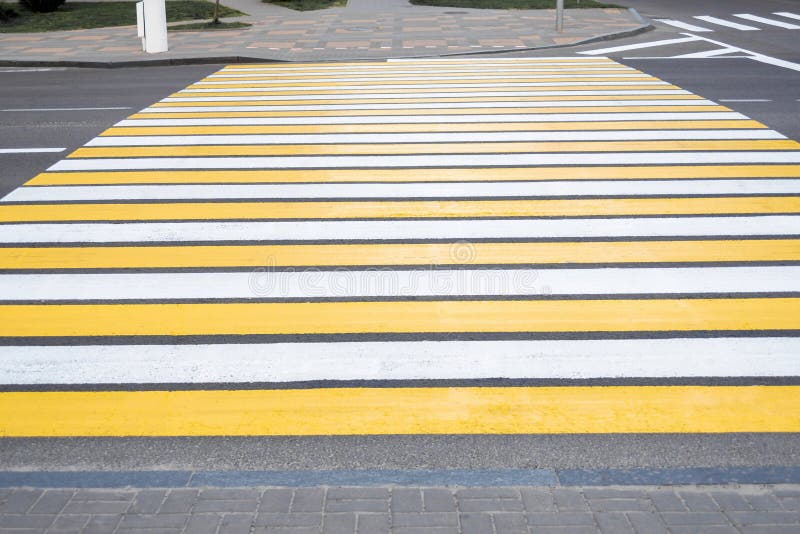Yellow-white Pedestrian Crossing on Asphalt. Close-up of the Road Stock ...