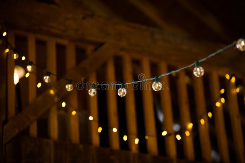 Yellow and White String Lights Hanging in a Barn Stock Image - Image of ...