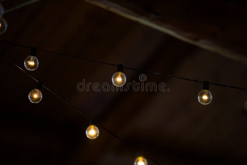 Yellow and White String Lights Hanging in a Barn Stock Photo - Image of ...