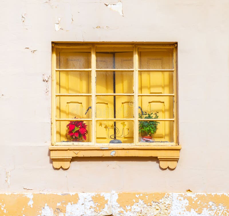 Yellow Window Shutters and Hanging Baskets Stock Image - Image of ...