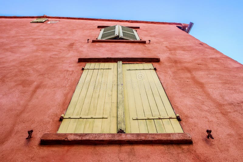 Yellow Windows on Red Building Stock Image - Image of white, colorful ...