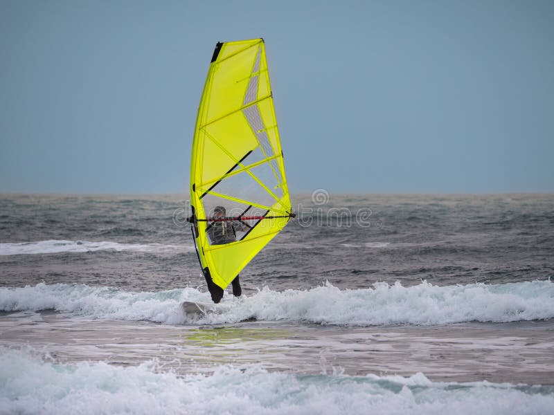Yellow Windsurf Riding the Waves Stock Photo - Image of travel, speed ...