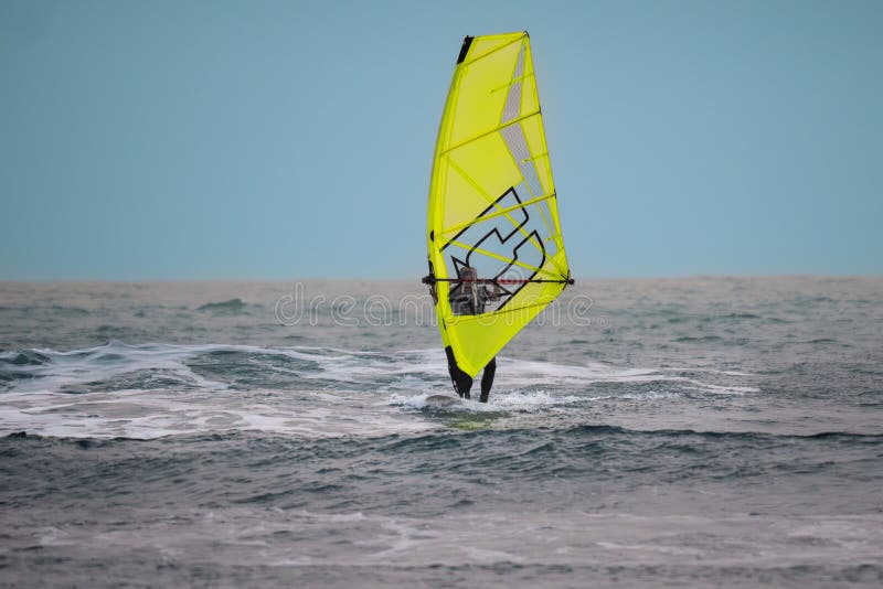Yellow Windsurf Riding the Waves Editorial Image - Image of sand ...