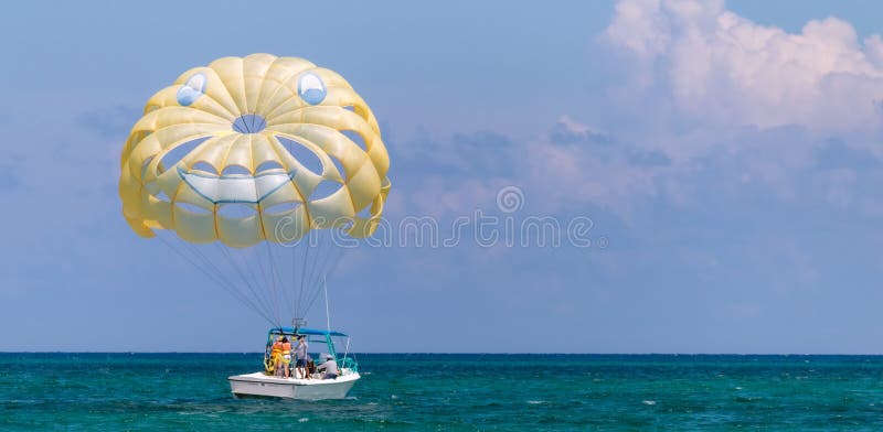 Yellow Wing with Happy Face from Skydiving Pulled by a Boat. Summer ...